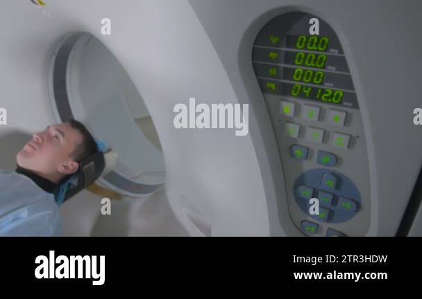 Patient in a Emergency hospital MRI scanner. Man lays in Magnetic ...