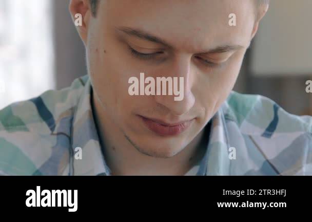 Close up portrait of young man working, slow motion Stock Video Footage ...