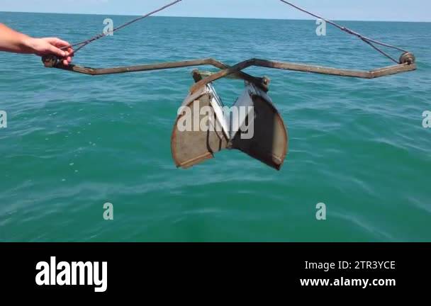 Marine Research: The bottom sampling device (bottom grabber) is lowered ...