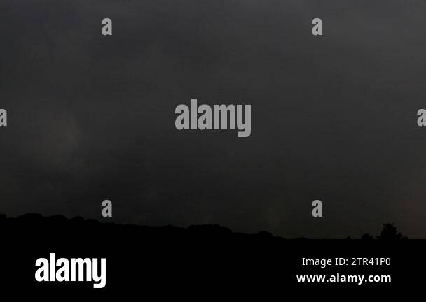 Storm and shower with lightning. Heavy rain with black clouds and wind ...