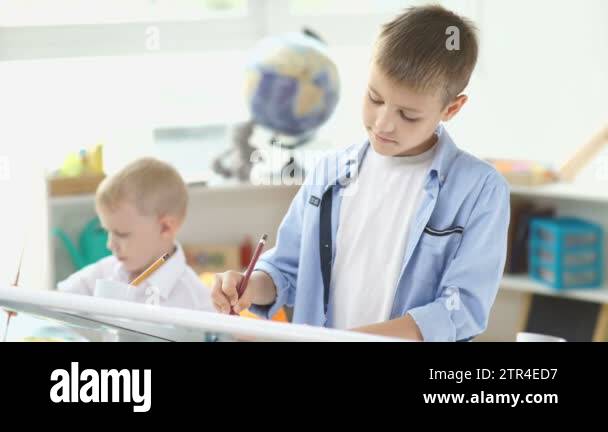 Two brothers draw. Little brothers are busy drawing Stock Video Footage ...