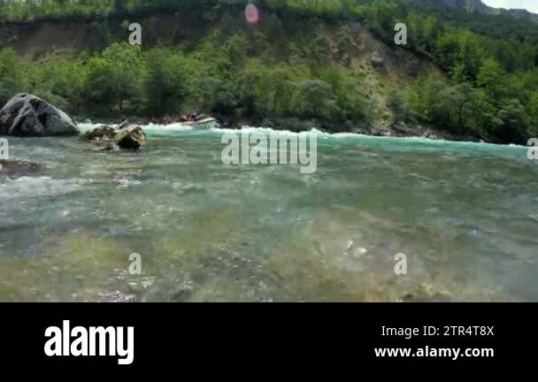 Group of People White Water Rafting. A group of people enjoying white ...