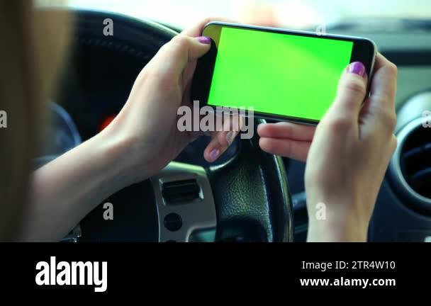 Girl Driver closeup, greenscreen in the car, urban city background ...