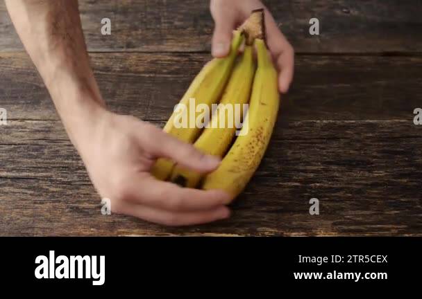 Hand of bananas Stock Videos & Footage - HD and 4K Video Clips - Alamy