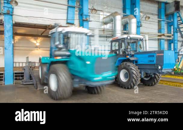 Conveyor assembly final stage of tractor at factory timelapse Stock ...