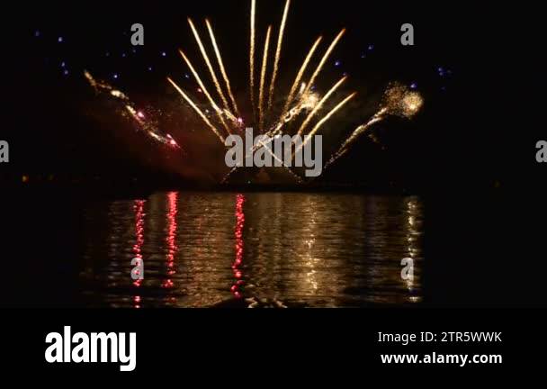 Fireworks at the River Bank Bright Colored Sparks Are Reflected in ...