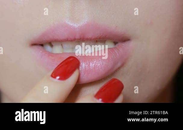 girl touching sores on the lips. herpes. lip treatment, Young plump ...