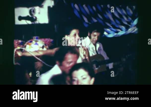 Disco nightclub singer with dancing crowd Stock Video Footage - Alamy