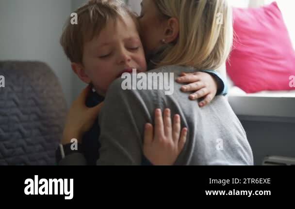 Upset little boy hugging his mother and crying at home Stock Video ...