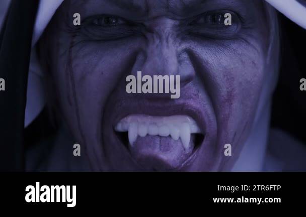 zombie nun. devilish woman in nun costume walking around the temple ...