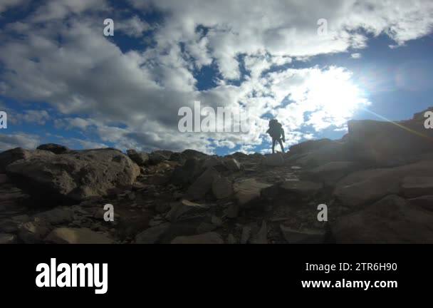 Trekking in Batea Mahuida volcano. Lady carrying baby in special bag ...