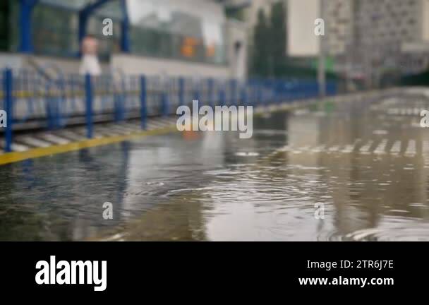 drops of rain fall on platform, railway concept, weather concept, urban ...