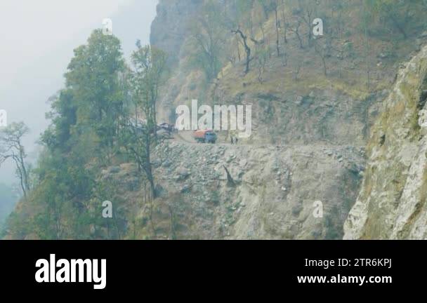 Backpackers on the alpine path on the Manaslu mountain circuit trek in ...