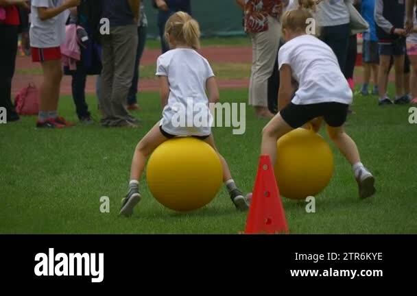 Two Little Girls Hurry to Come to a Finish Line Stock Video Footage - Alamy
