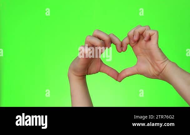 A hand heart. Person forms a heart shape using their fingers. Two ...