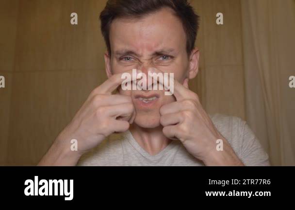 Squeeze nose Stock Videos & Footage - HD and 4K Video Clips - Alamy