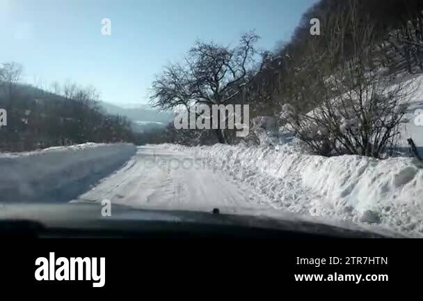 Driving a Car on Rural Country Road in Winter. Snow and Ice on Highway ...