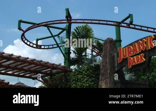 Tourists have fun at the roller coaster at the Universal studio theme ...