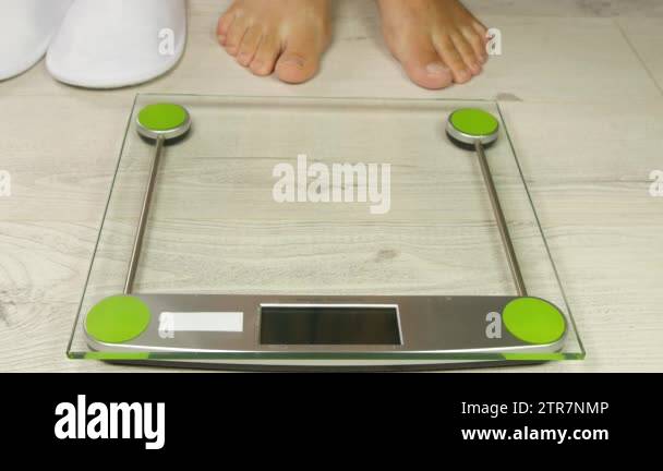Close View with Man Checking His Weight Using a Digital Scale (Ultra ...
