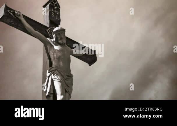 Crucifixion. Christian cross with Jesus Christ statue over stormy clouds time lapse Stock Video ...
