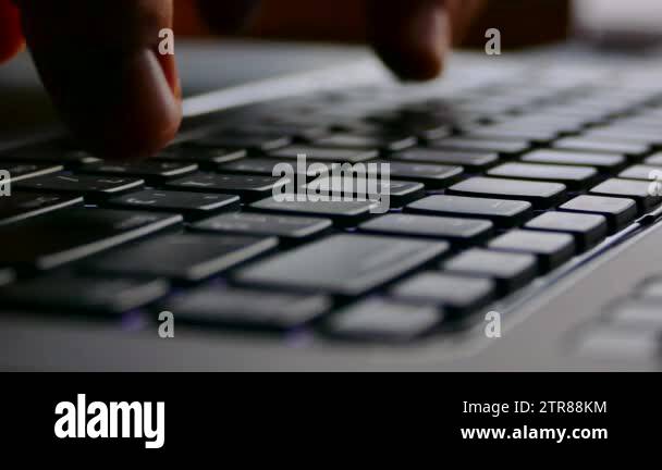 Press the buttons on the laptop keyboard. Work on computer. Type text ...