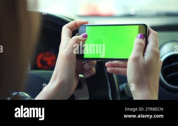 Girl Driver closeup, greenscreen in the car, urban city background ...