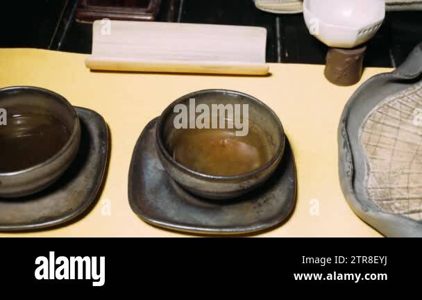 Pouring tea with the help of ladle.Tea ceremony. Brewing tea in the ...