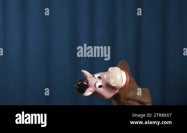 Horse hand puppet makes vivid scene exit and run away with blue ...
