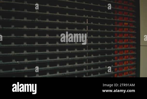 Wall of metal grid. Metal structure of the bars and mesh. Dark worn ...