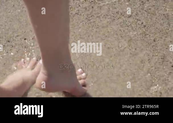 Washing sandy feet Stock Videos & Footage - HD and 4K Video Clips - Alamy