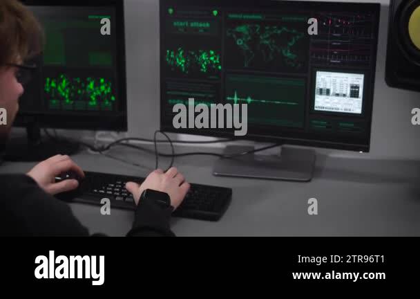 Computer room. Man on edge. Hacker gets nervous hands on the keyboard ...