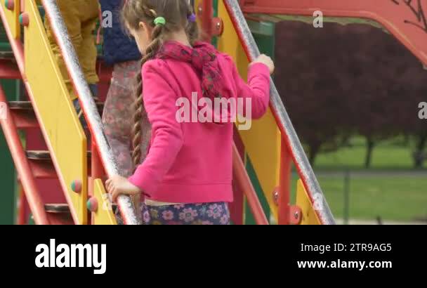 Kids Are Climbing up the Chute Blonde Girl and Boy Chute is Painted in ...