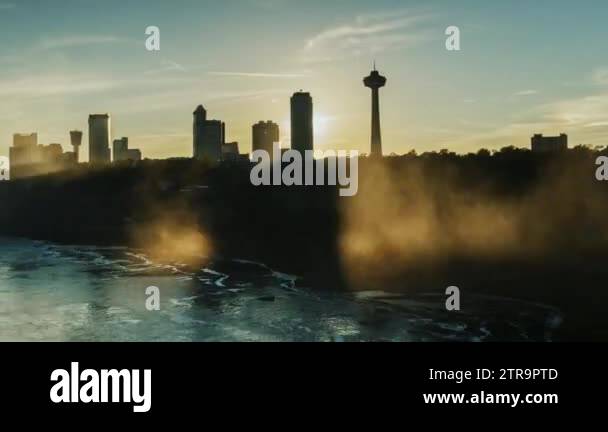 Sunset over buildings of Niagara Falls on the Canadian side of the ...