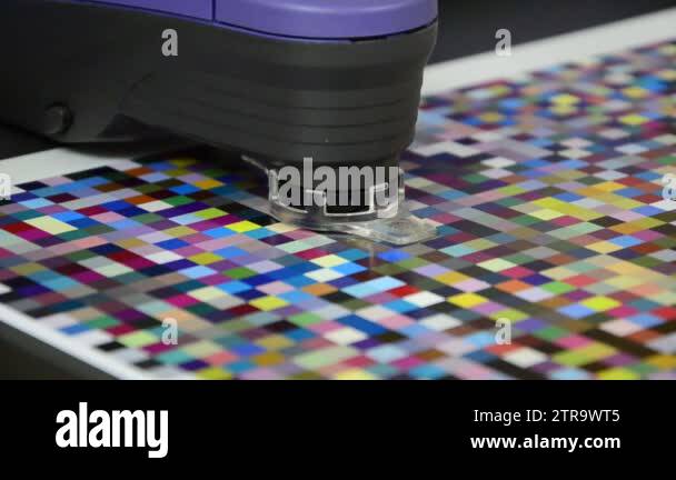 Press shop, spectrophotometer robot measurement of color patches in ...