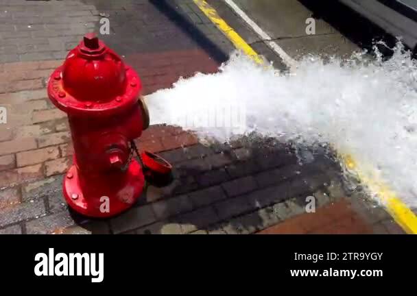 Fire hydrant gushing clean water flow in the streets Stock Video ...