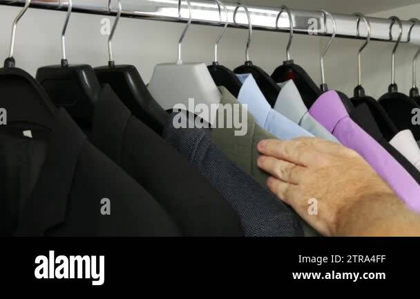 Man Choosing a Suit from Personal Wardrobe (Ultra High Definition ...