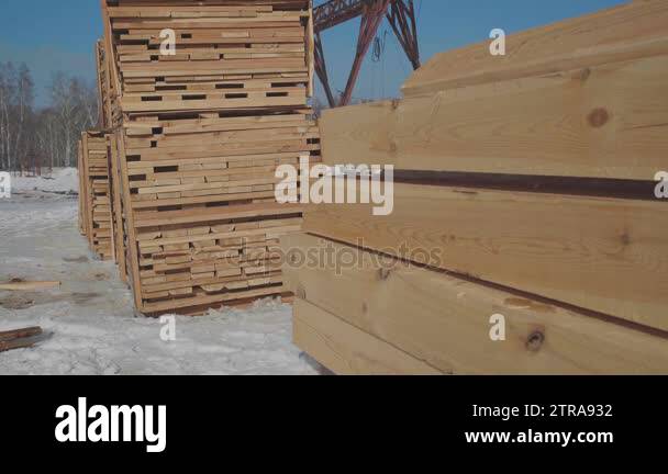 Wooden beams and boards neatly stacked in a pyramid shape Stock Video ...