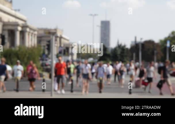 Crowd of people moving legs are going through a transition. City ...