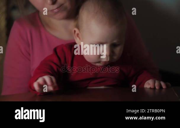 Hold boy on lap Stock Videos & Footage - HD and 4K Video Clips - Alamy