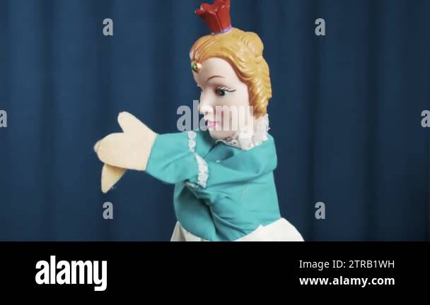 Princess hand puppet rubbing and shaking arms , waving on blue ...