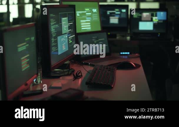 Developer and hacker hidden workstation, multiple screens and connected computers: cyber ...
