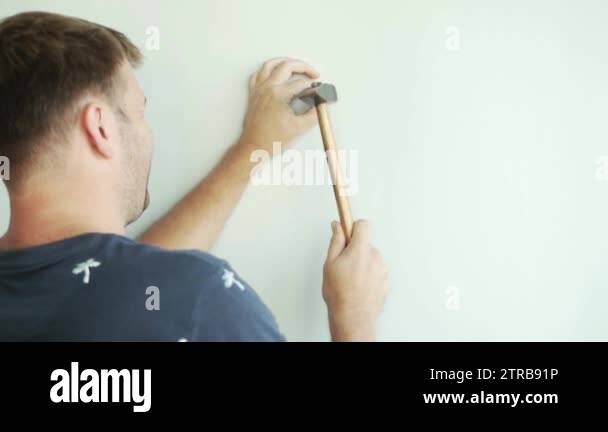Man hammering nail wall Stock Videos & Footage - HD and 4K Video Clips ...