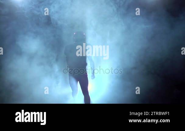 Two soccer player running and face the battle in the smoke. Slow motion ...