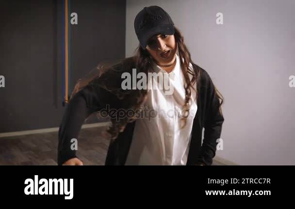 Young girl dancing the unusual dance using hands and facial expressions ...