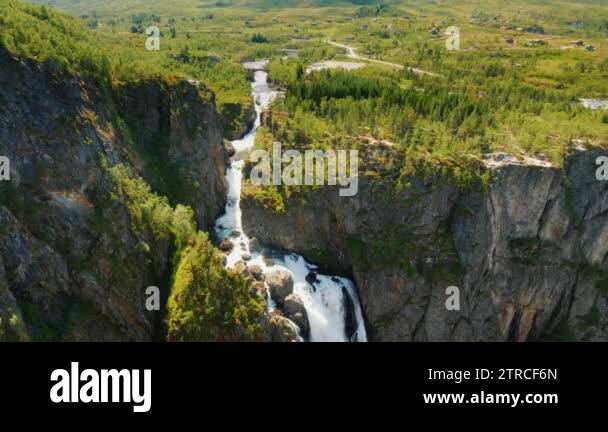 Tilt dawn shot: The famous waterfall Voringsfossen in Norway ...