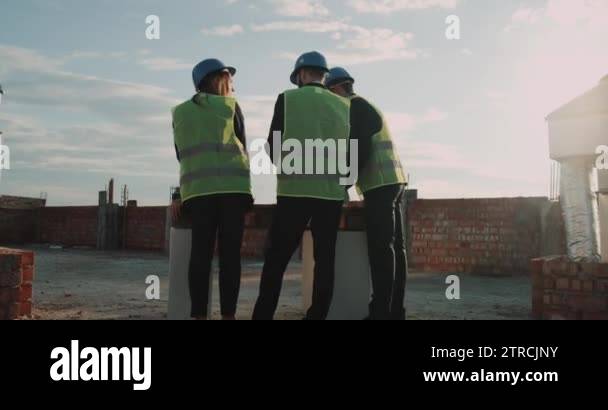 Workteam engineers analyzing the scheme map of building on construction ...