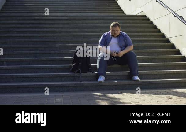 Fat man stairs Stock Videos & Footage - HD and 4K Video Clips - Alamy