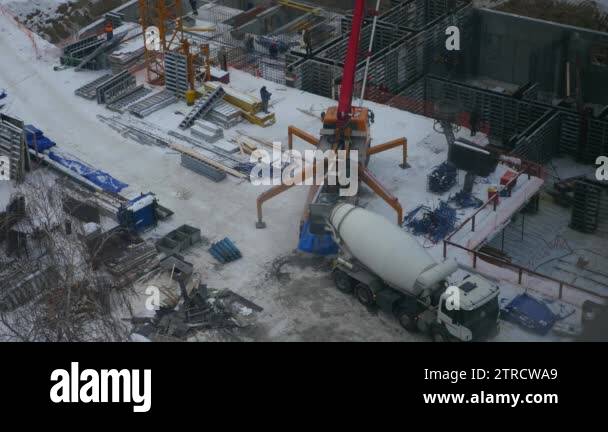 concrete mixer machine at a construction site and is pumped pump ...