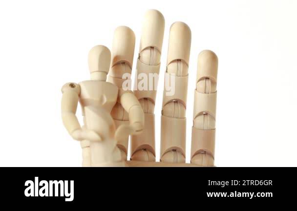 Rotation of toy giant arm and little toy man on its thumb Stock Video ...