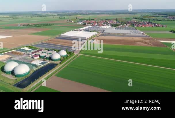 Aerial video of Biogas plant. The agricultural and greenhouse complex ...